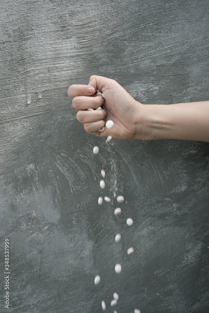 Stop drug addiction concept. Crushed white pills falling from human ...