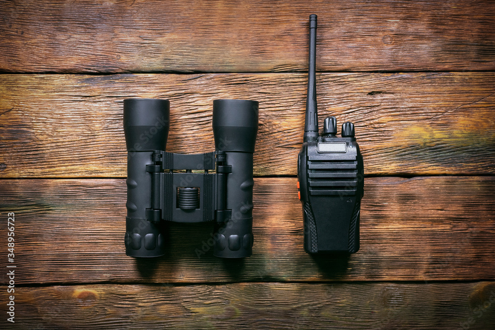 Spy secret service agent equipment on the wooden table background ...