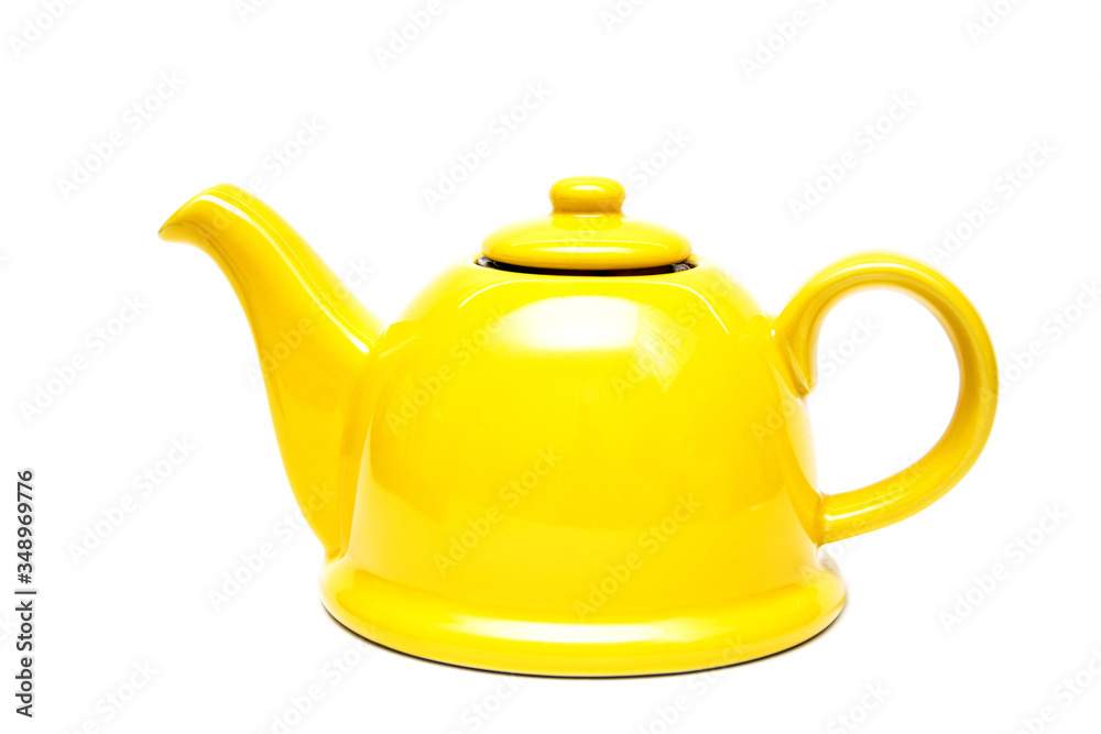 Ceramic yellow teapot on a white background. Isolate. Place for an ...