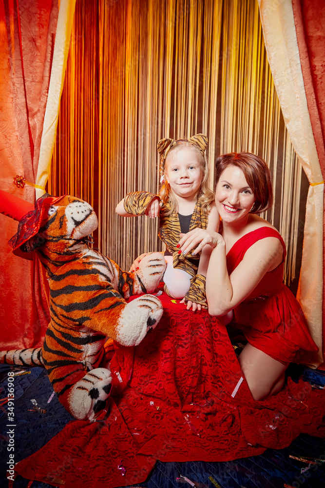 Family during a stylized theatrical circus photoshoot in a beautiful ...