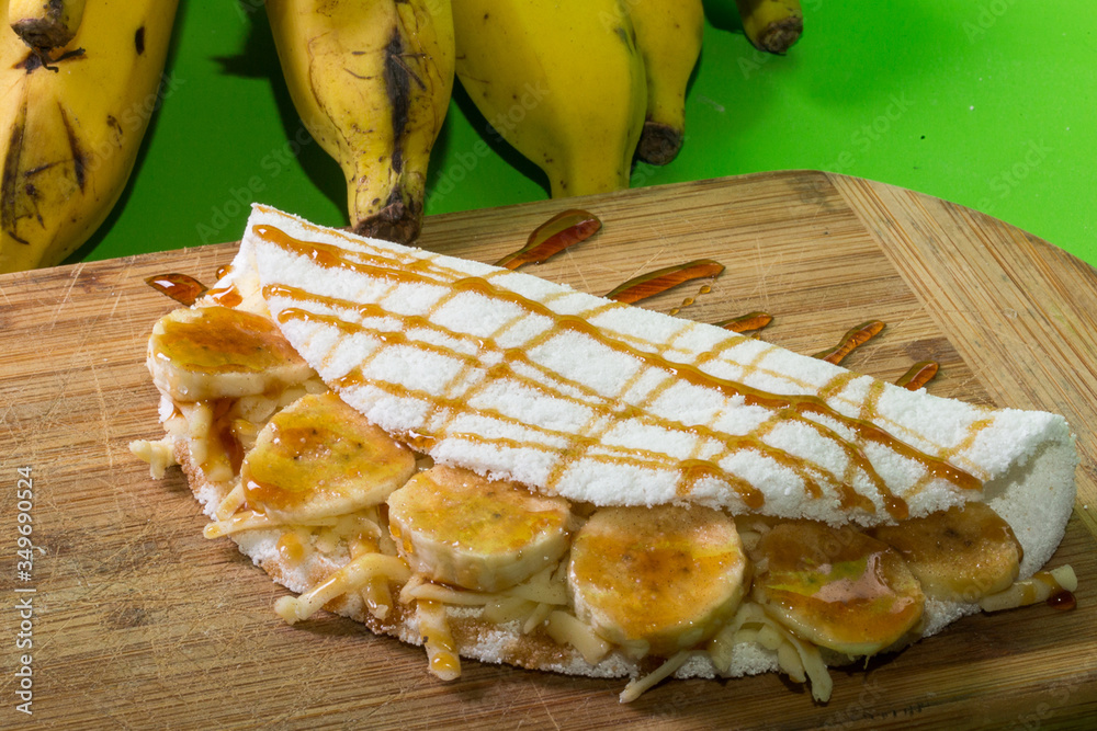 Tapioca with banana and cheese and honey. flatbread made from cassava ...