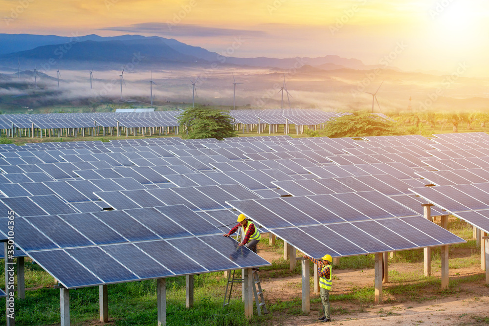 Stock-Foto „Engineering team inspecting or repairing solar cells on ...