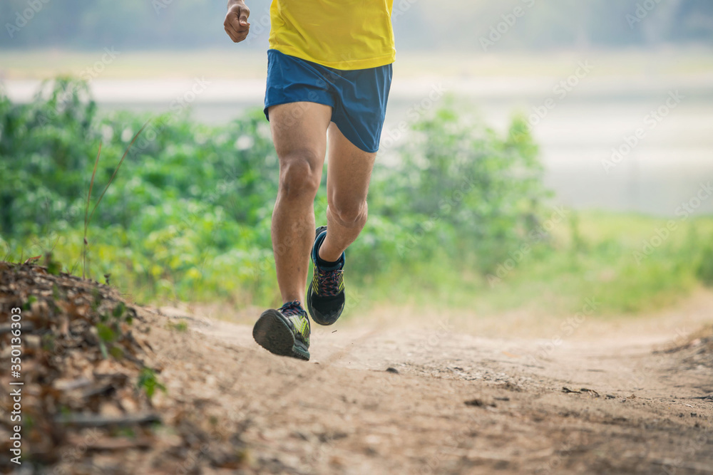 Outdoor trail running in early sunrise concept for exercising, fitness ...