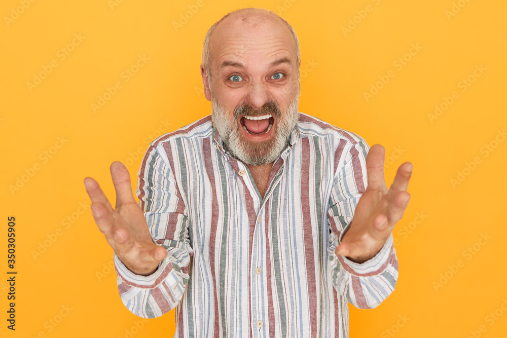 Picture of angry mad elderly unshaven quick-tempered male screaming and ...