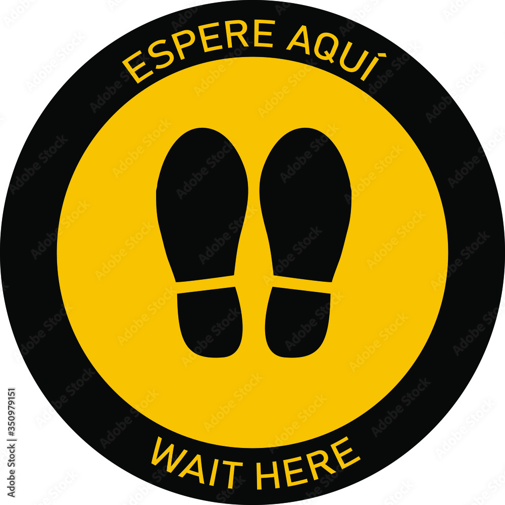 Black and yellow warning sign with footprint and the text Wait here and ...