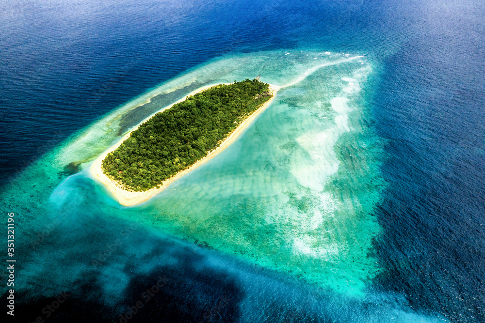 Aerial view of uninhabited island Bilang Bilangan, near Borneo ...