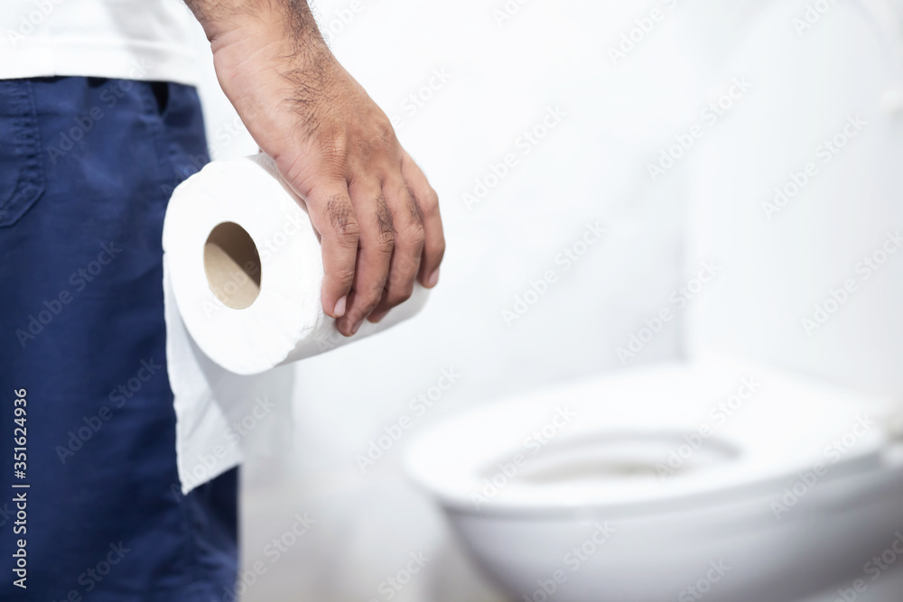 Man suffers from diarrhea hand hold tissue paper roll in front of ...