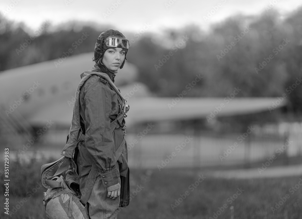 Stock-Foto „Retro style black and white. A young female pilot in ...