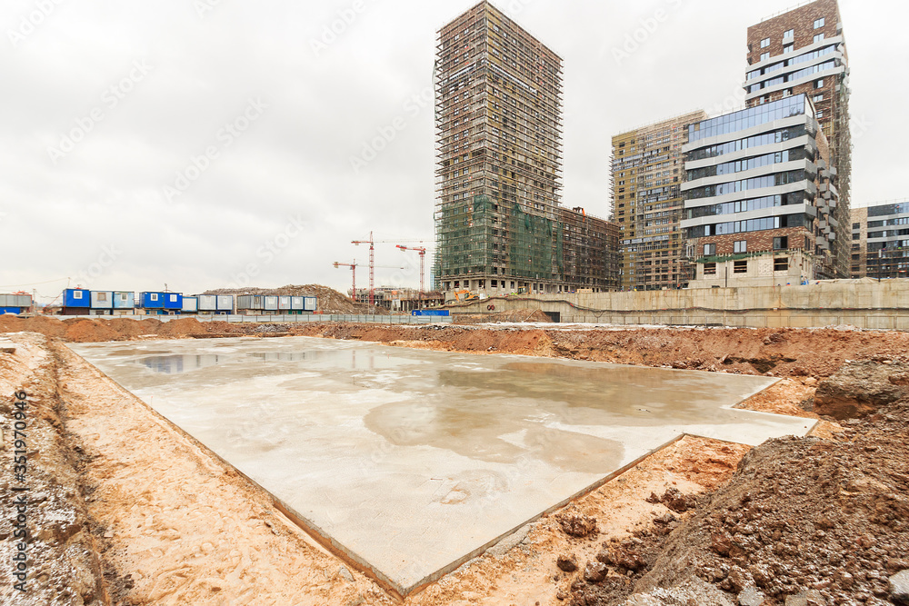 Pile driving in foundation pit for construction of apartment building ...
