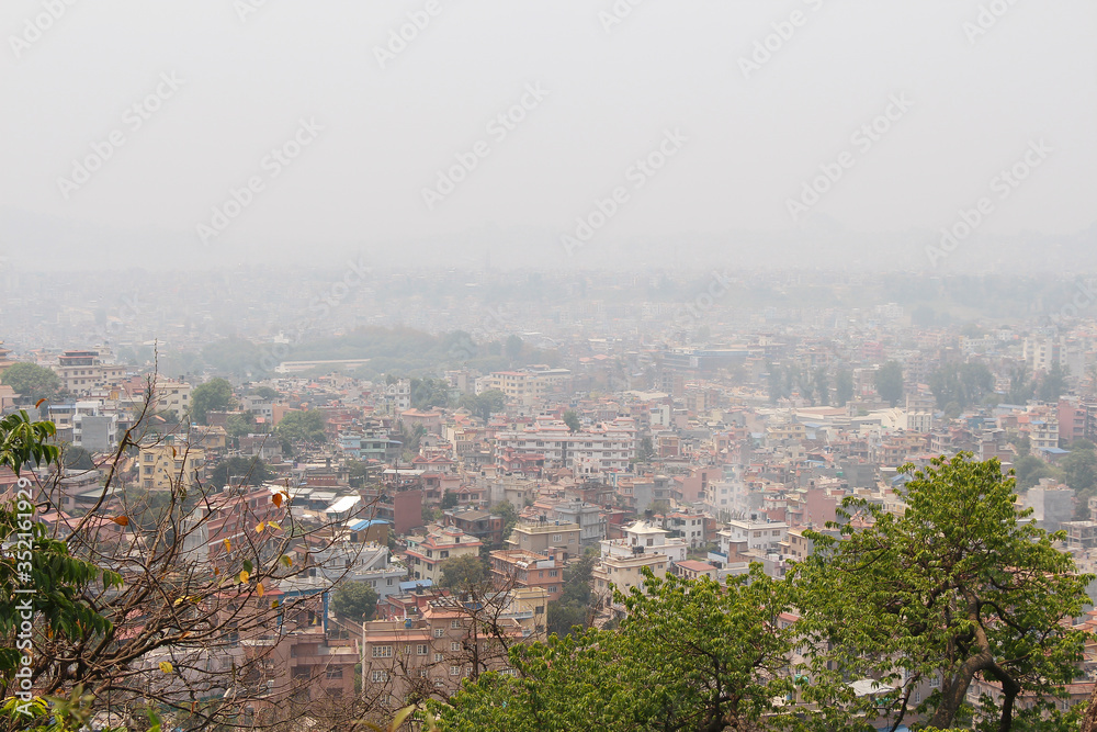 Cityscape of Kathmandu city in Nepal. Smog covers the sky. Most of ...