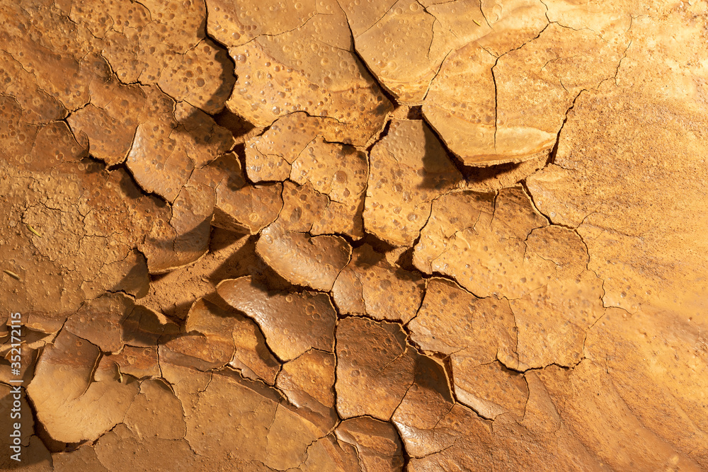 Cracked earth texture of ground, broken and rough surface gray mud clay ...