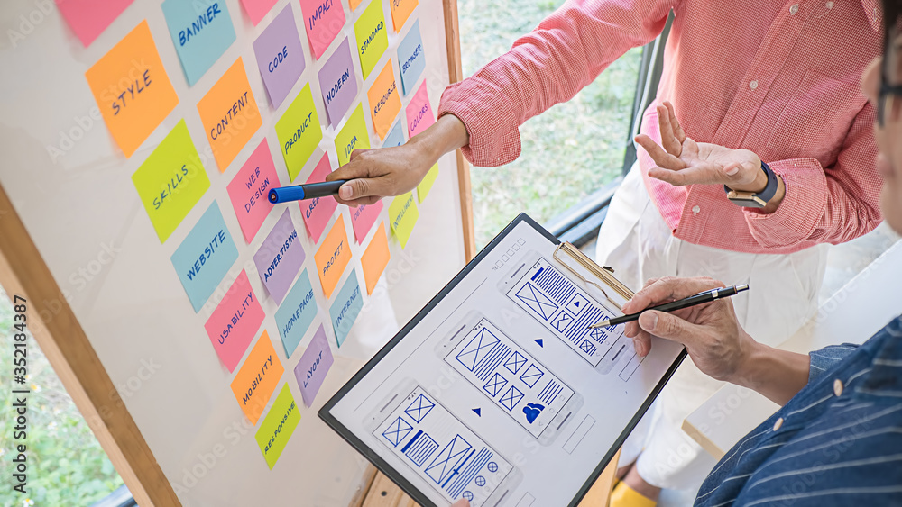 Web designer brainstorming for a strategy plan. Colorful sticky notes ...