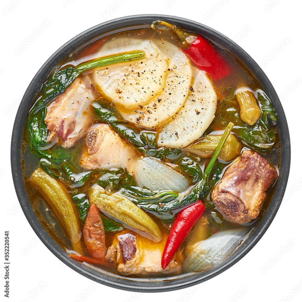 Sinigang na Baboy or Filipino Pork Meat Soup in black bowl isolated on ...