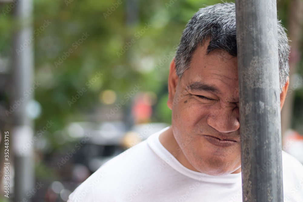 unlucky careless old senior man hitting his head with iron pole ...