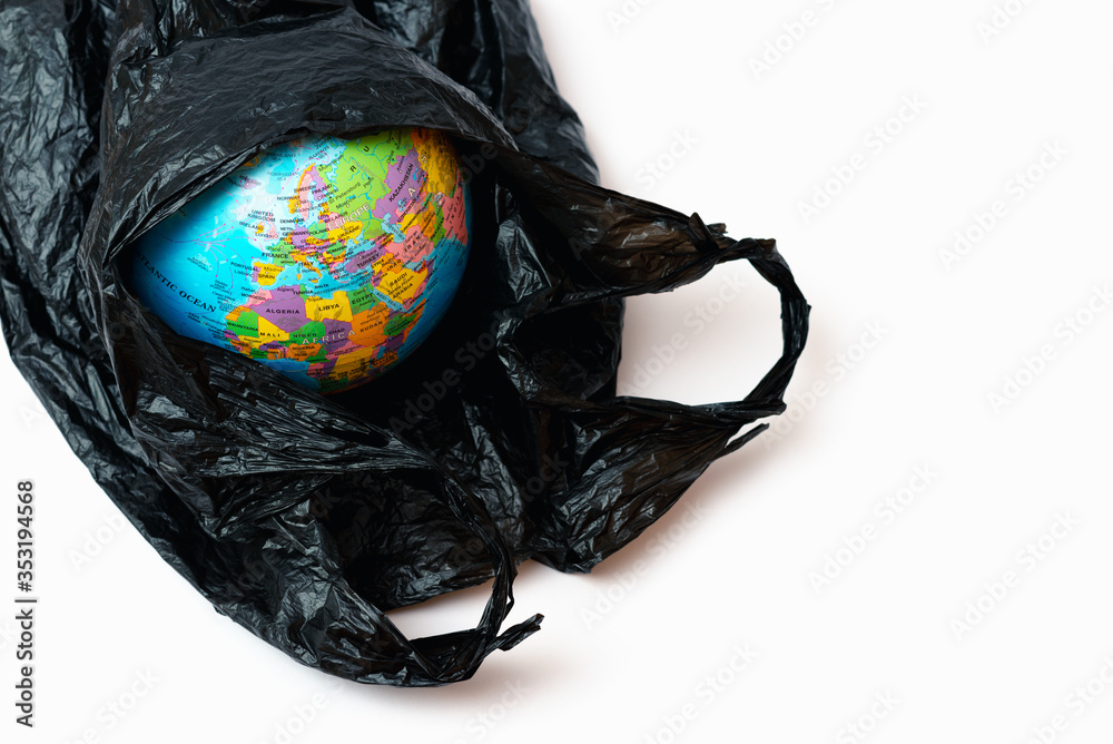 World Globe inside plastic bag you can see in hole different parts of ...
