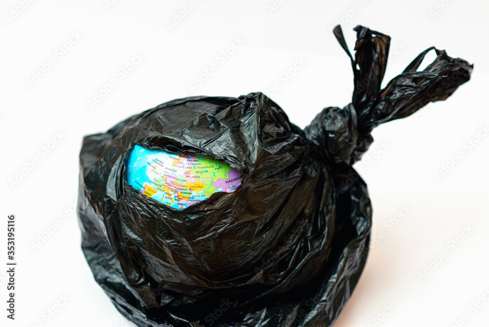 Foto de Stock World Globe inside plastic bag you can see in hole ...