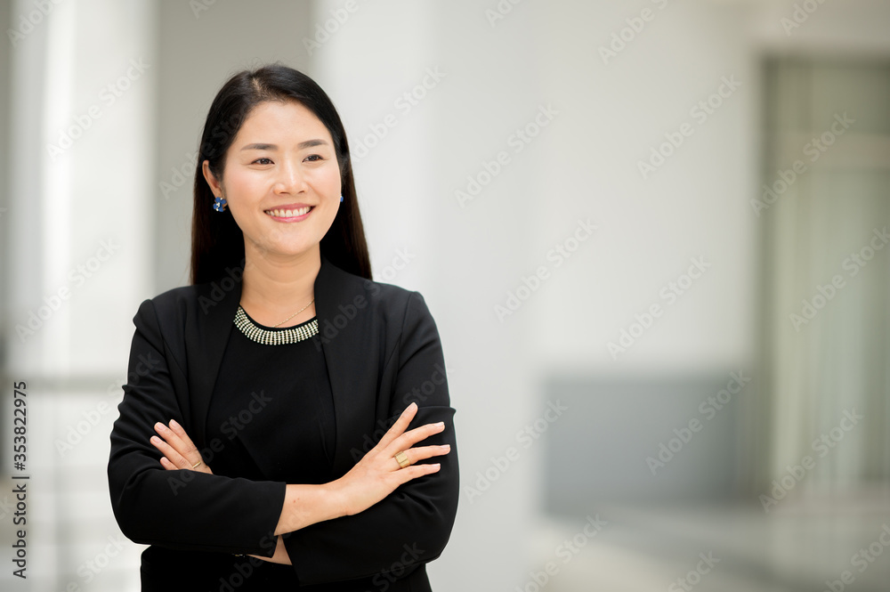portrait Working woman Asian wearing a black suit, smiling, Crossed ...