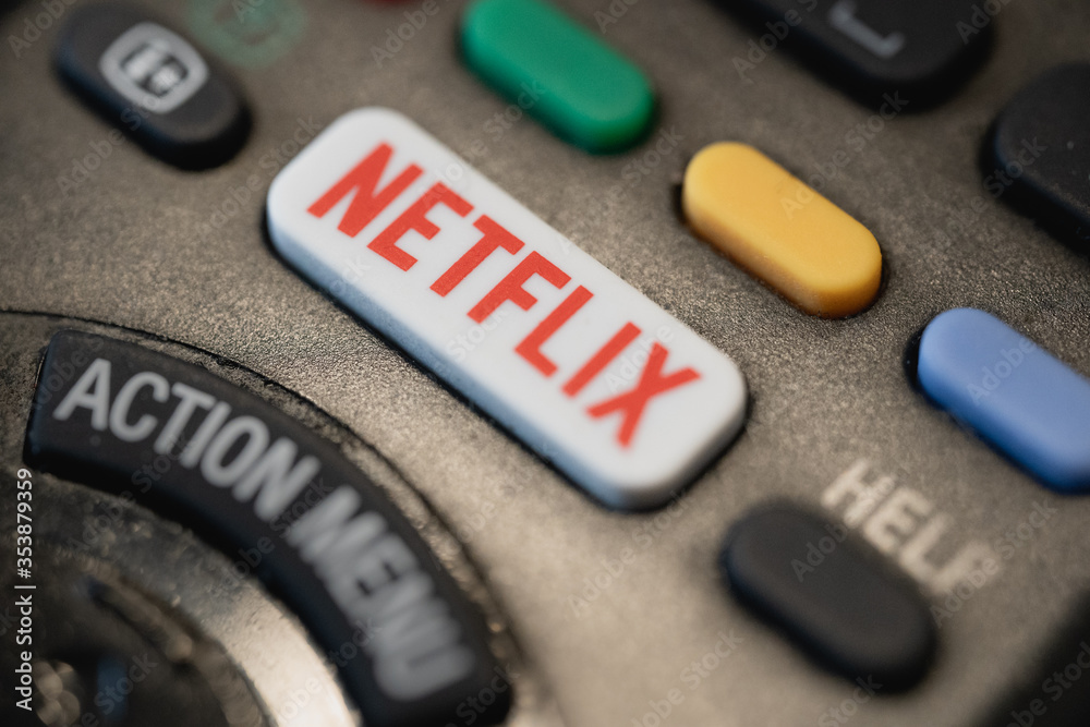 tv remote control with close up of the Netflix logo on the center. Tv ...