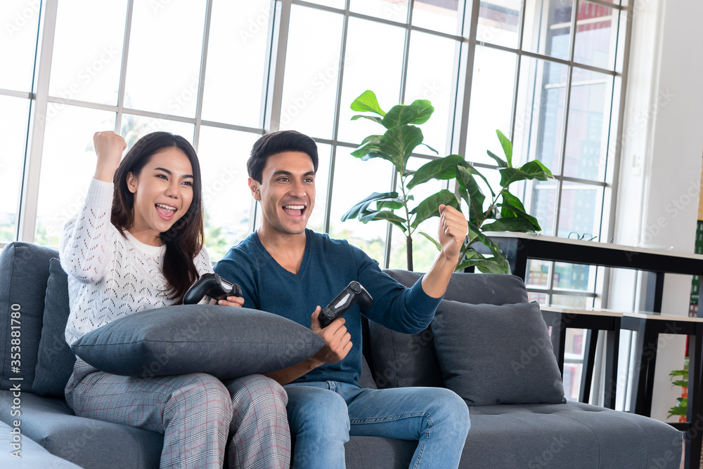Gaming time in family, couple enjoy playing games together at home ...