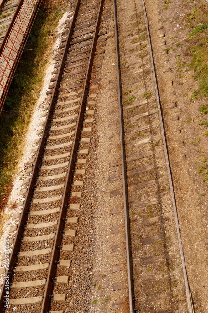 Two railroad tracks converge to each other. Top view. The concept is ...