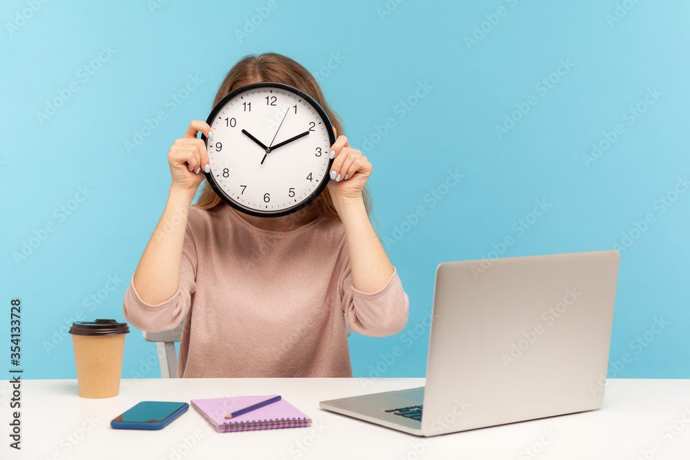 Time to work! Woman office employee sitting at workplace and covering ...