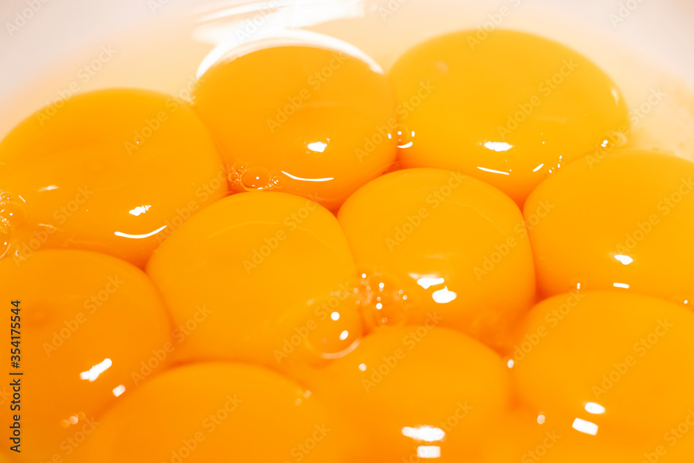 Farm orange egg yolks. The yolk of the eggs have vitamins and minerals ...