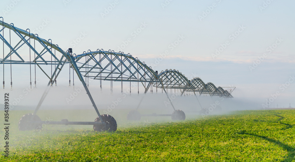 Moved irrigation system on a farmer's field. Field irrigation with a ...