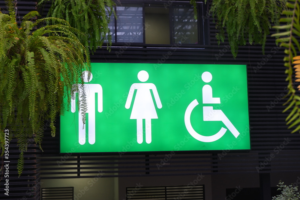 Toilet symbol showing men, women, and people with disabilities. Green ...