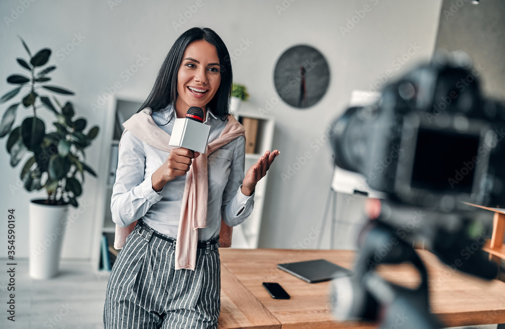 Female journalist working Stock Photo | Adobe Stock