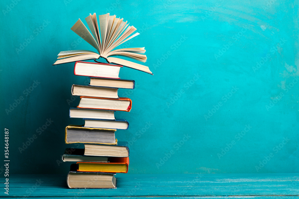 Books on wooden desk table and abstract background. Education ...