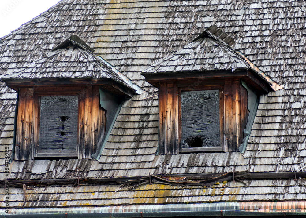 Traditional shingle roof cladding with two dormer roof windows ...