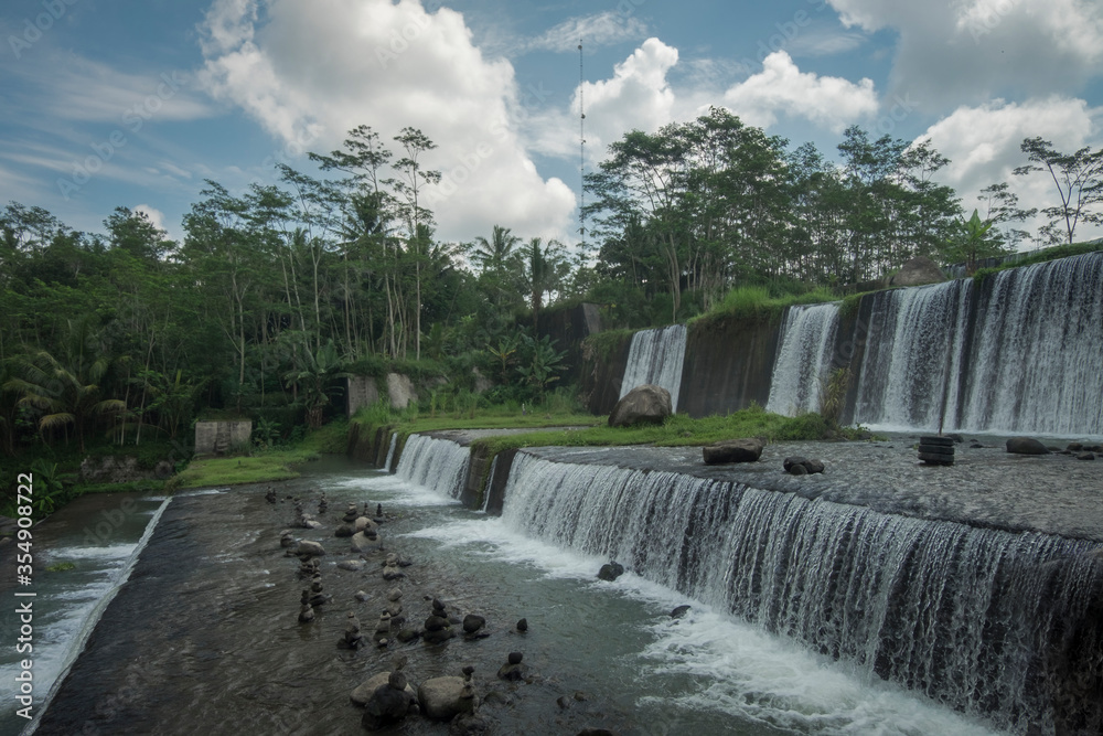 (Grojogan Watu Purbo) Watu Purbo waterfall is a multi-storey river dam ...