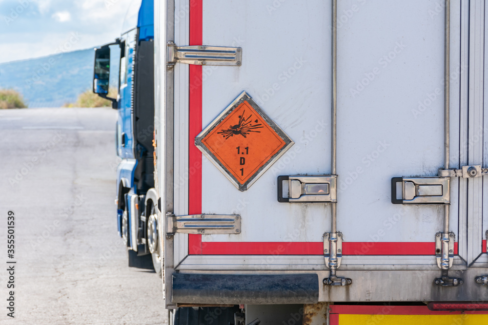 Truck transporting explosives, danger label according to the ADR ...