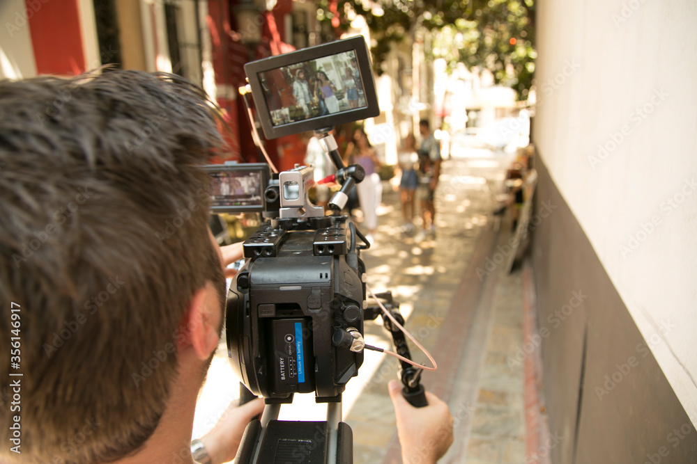 Behind the scene. Cameraman shooting the film scene with camera Stock ...