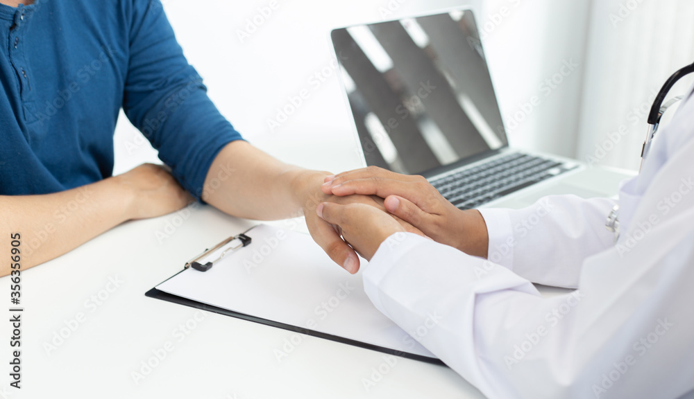 Female doctors use blood pressure monitors and stethoscope to measure ...