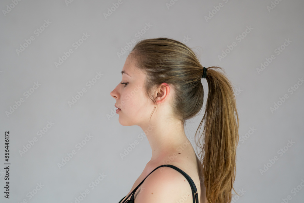 Profile portrait of a pretty teenage girl with ponytail hair Stock ...