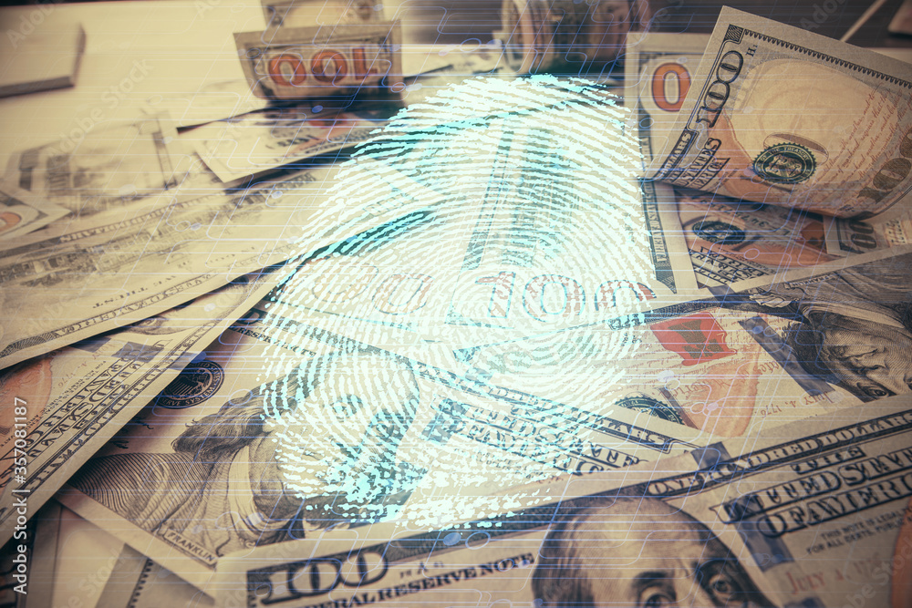Double exposure of finger print scan drawing over usa dollars bill ...
