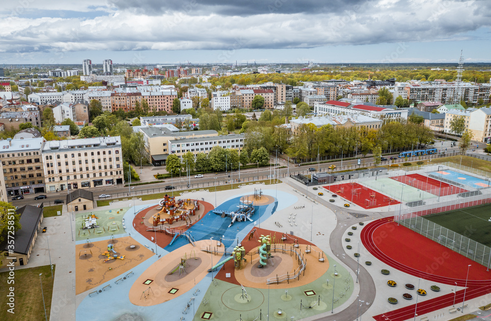 Suburbs in Riga with colorful playground, cobble streets ...