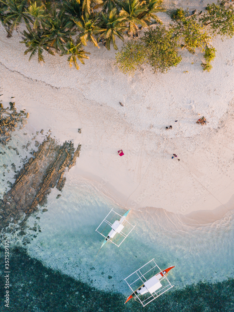Aerial photos of Guyam Island, a tear-drop shaped island in the ...