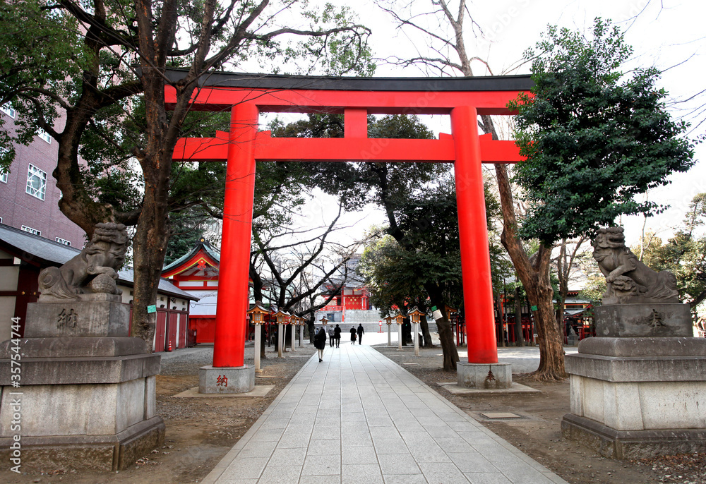 Red or vermilion torii gates at the Hanazono Jinja shrine, Shinjuku ...