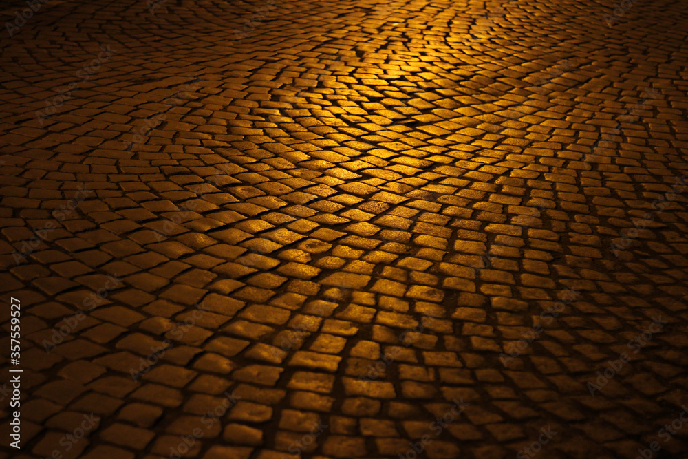 Golden night light on the street cobblestones Stock Photo | Adobe Stock