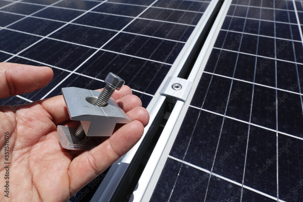 Hand Holding Middle Clamp of Solar PV Panel with How to Use on ...