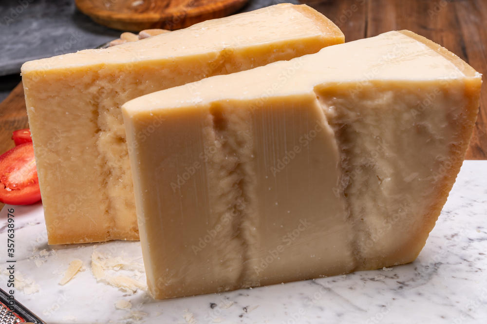Big wedges of parmigiano-reggiano parmesan hard Italian cheese made ...