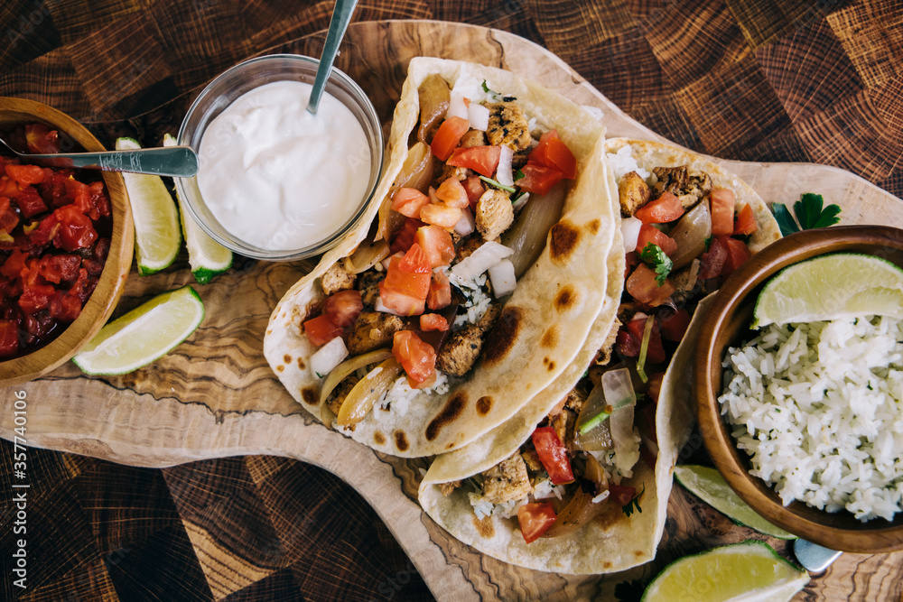 An olive board filled with delicious Mexican fiesta of food tacos and ...