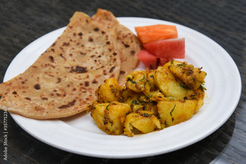 aloo roti tandoori roti or paratha, parantha with spicy jeera / masala ...