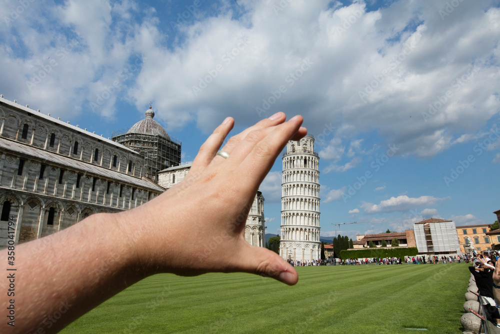 A silly fun false perspective view of the photographer’s hand holding ...