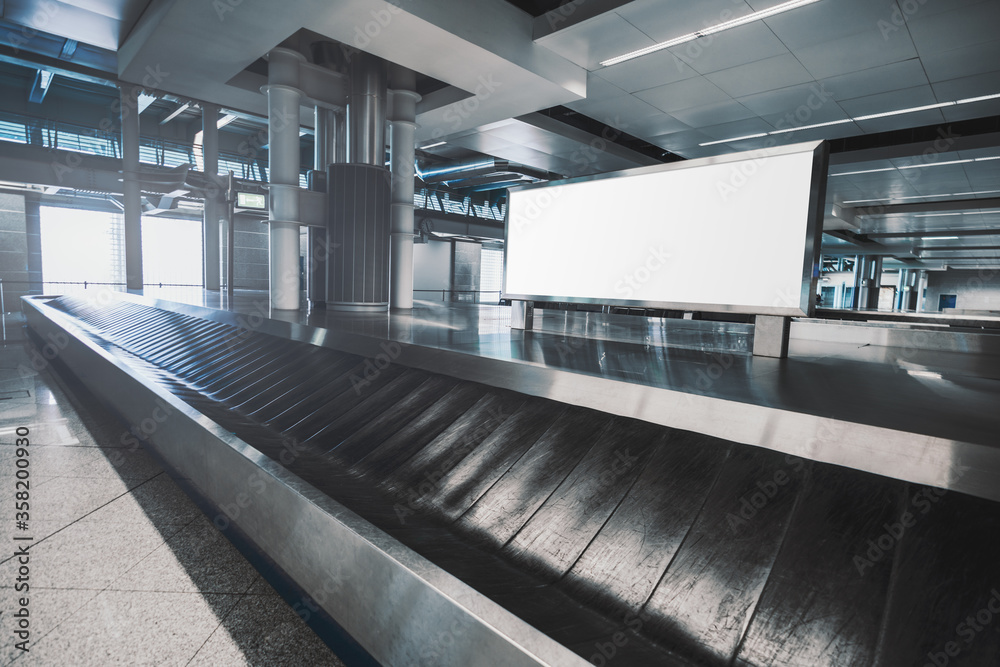 A white blank rectangular advertising billboard mock-up in airport ...