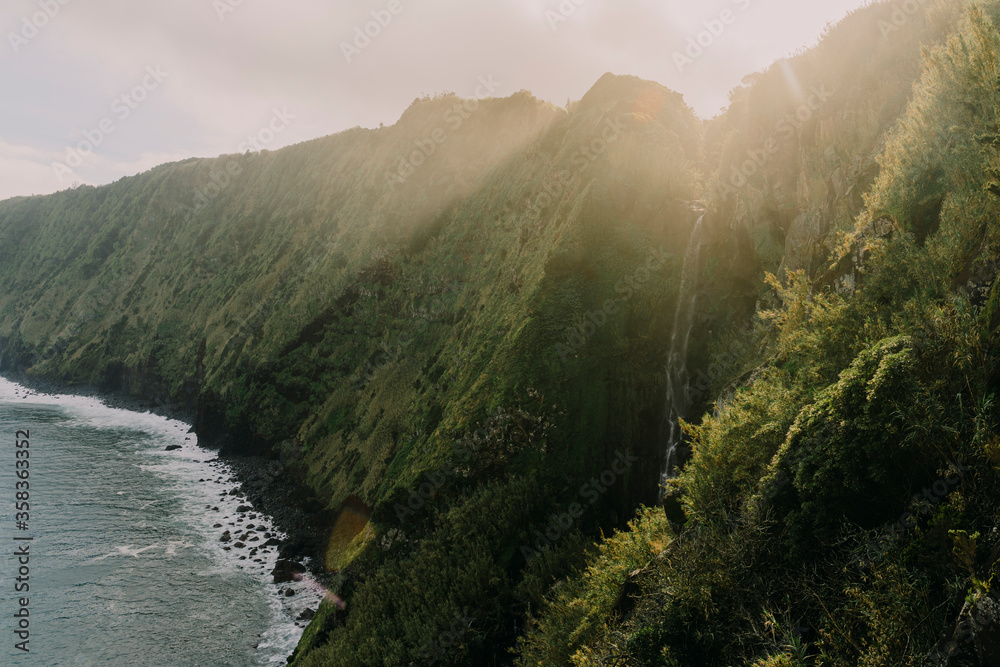 Steep coast with lens flare on Sao Miguel Island, Azores, Portugal ...