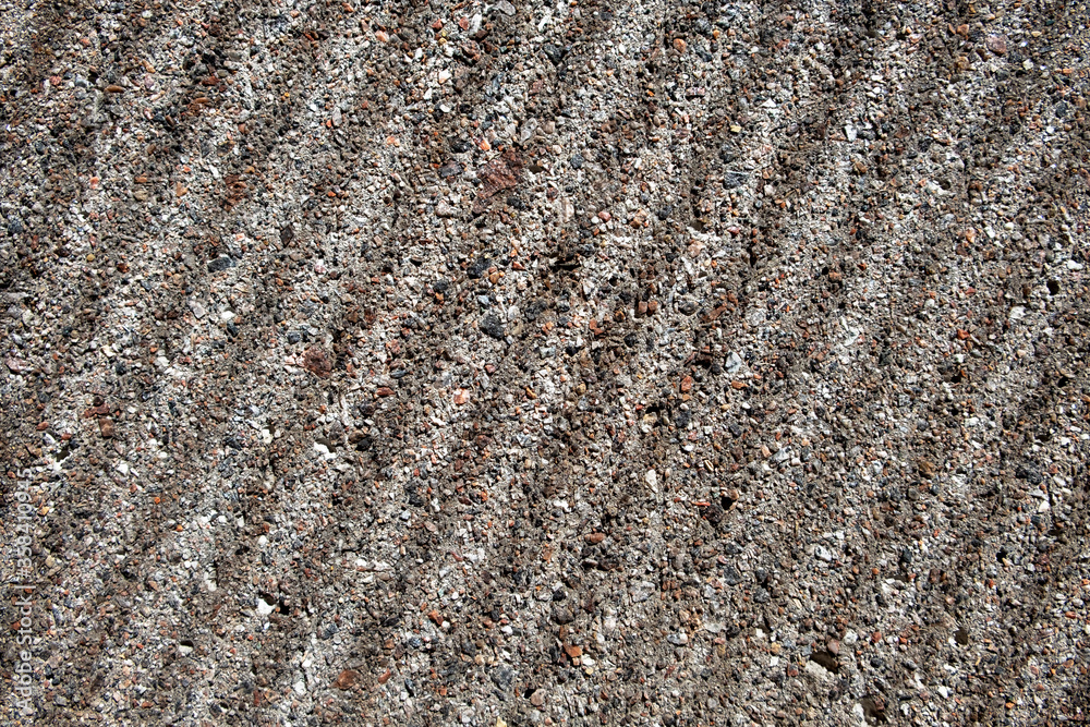 Stock-Foto „worn asphalt road with protruding small stones of different ...