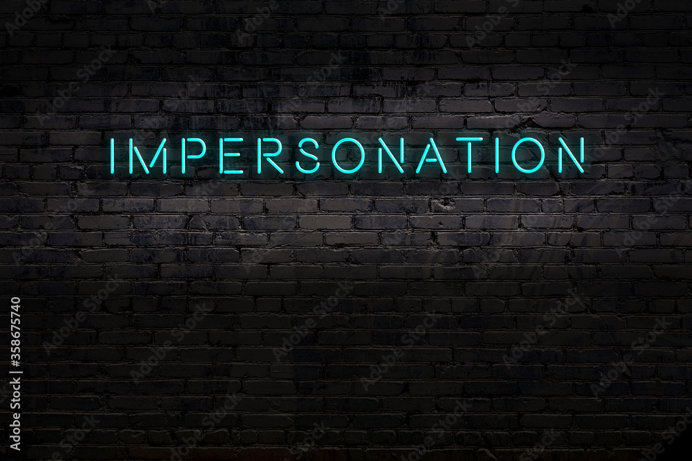 Neon sign. Word impersonation against brick wall. Night view Stock ...